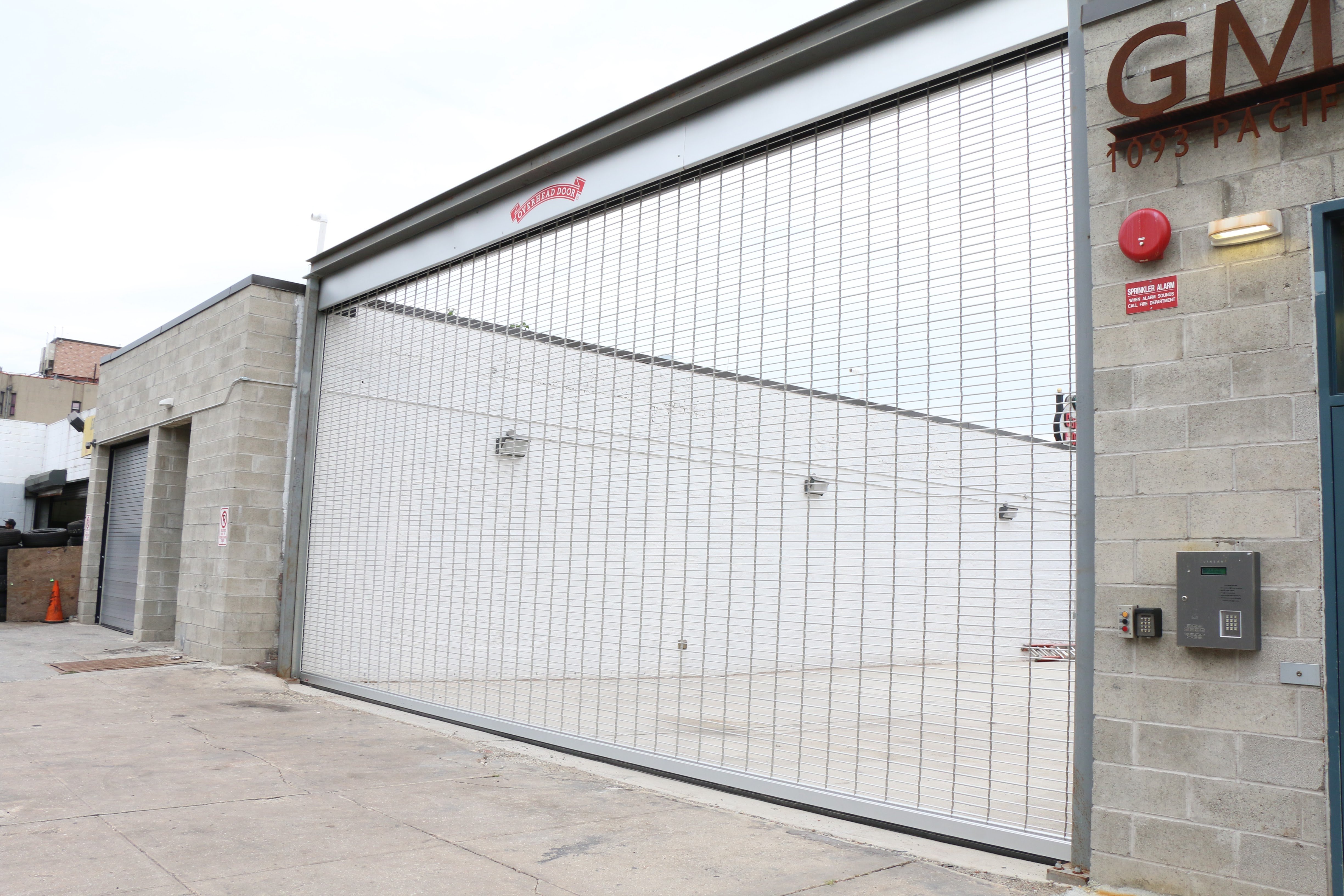 Security Grilles: Upward-Coiling & Side-Folding Doors